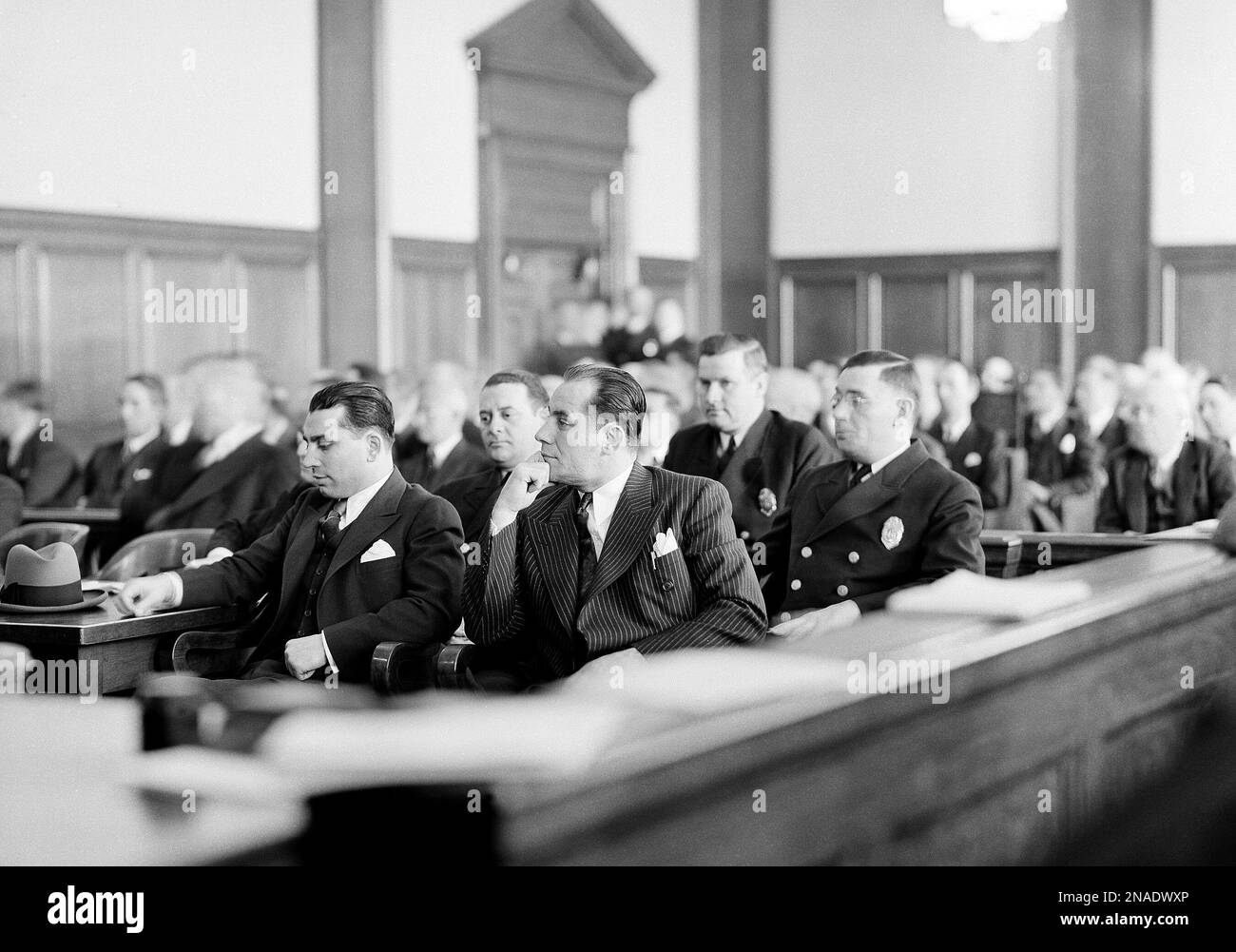 Harry “Happy” Maione, left, looks down sadly as Frank “The Dasher ...
