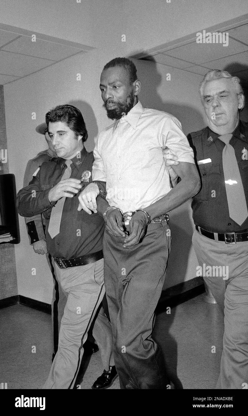 Rockland County, New York police officers lead handcuffed Samuel Brown ...