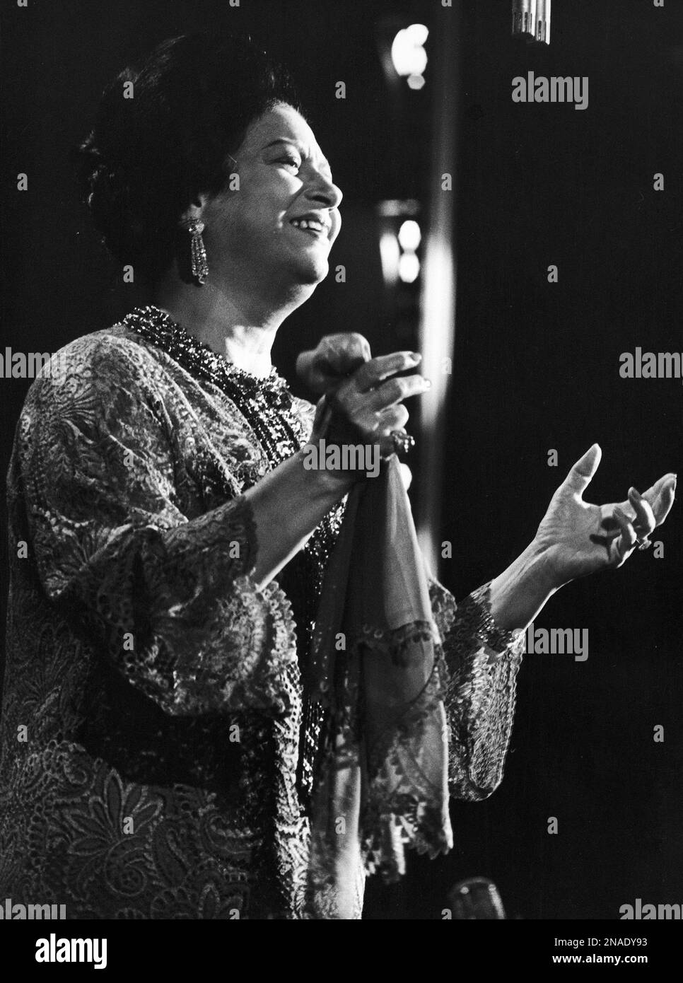 Egyptian singer Umm Kulthum performing to an audience of 2,200 at the ...