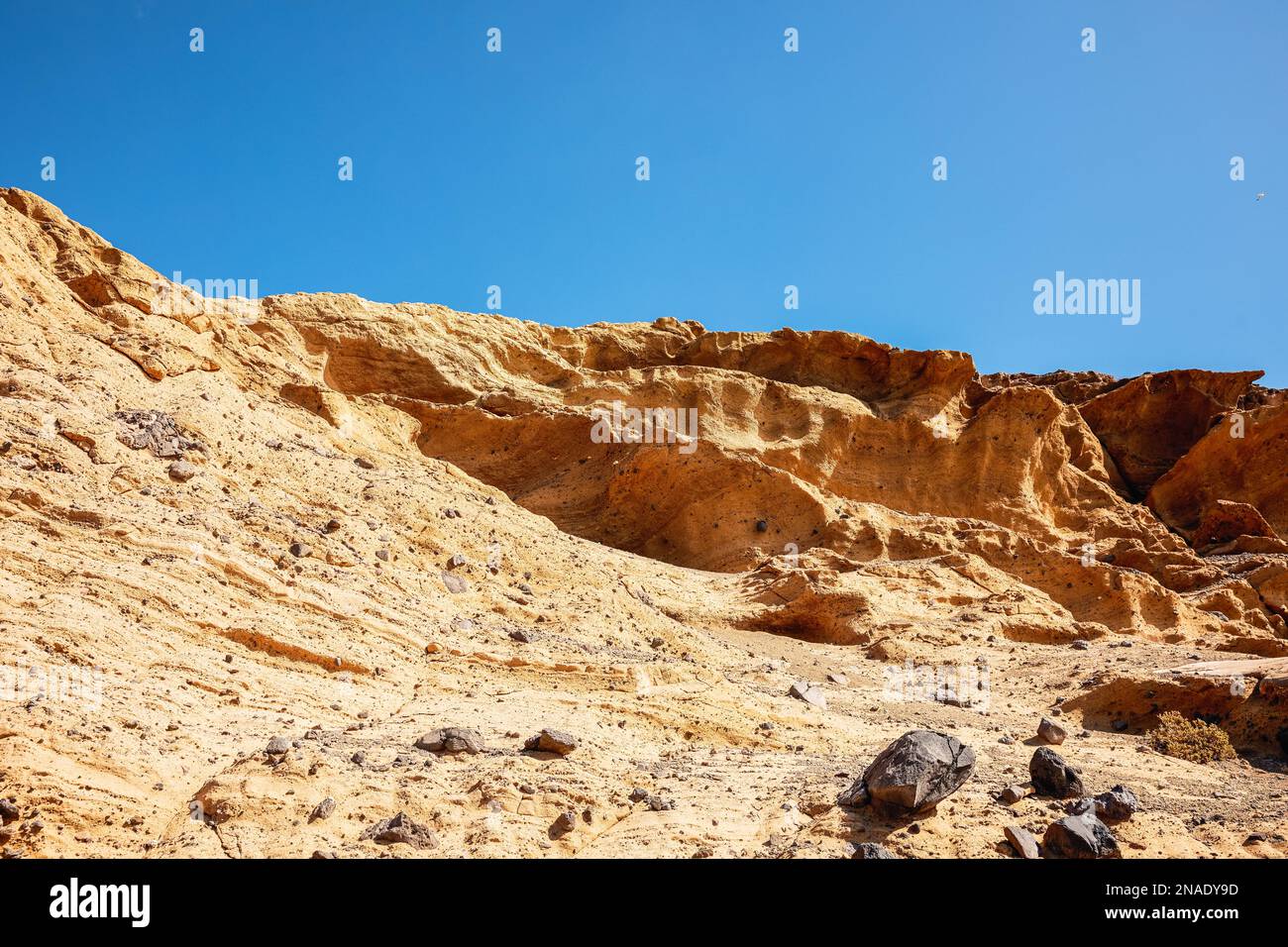 Landscape of sand and volcanic mountains with caves in the canary ...