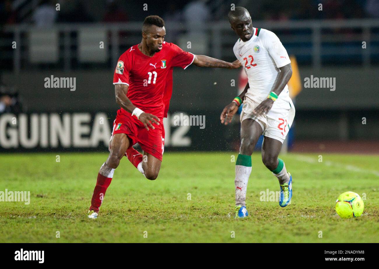 Equatorial Guinea's Javier-Angel Balboa ,left, fights for the ball with ...