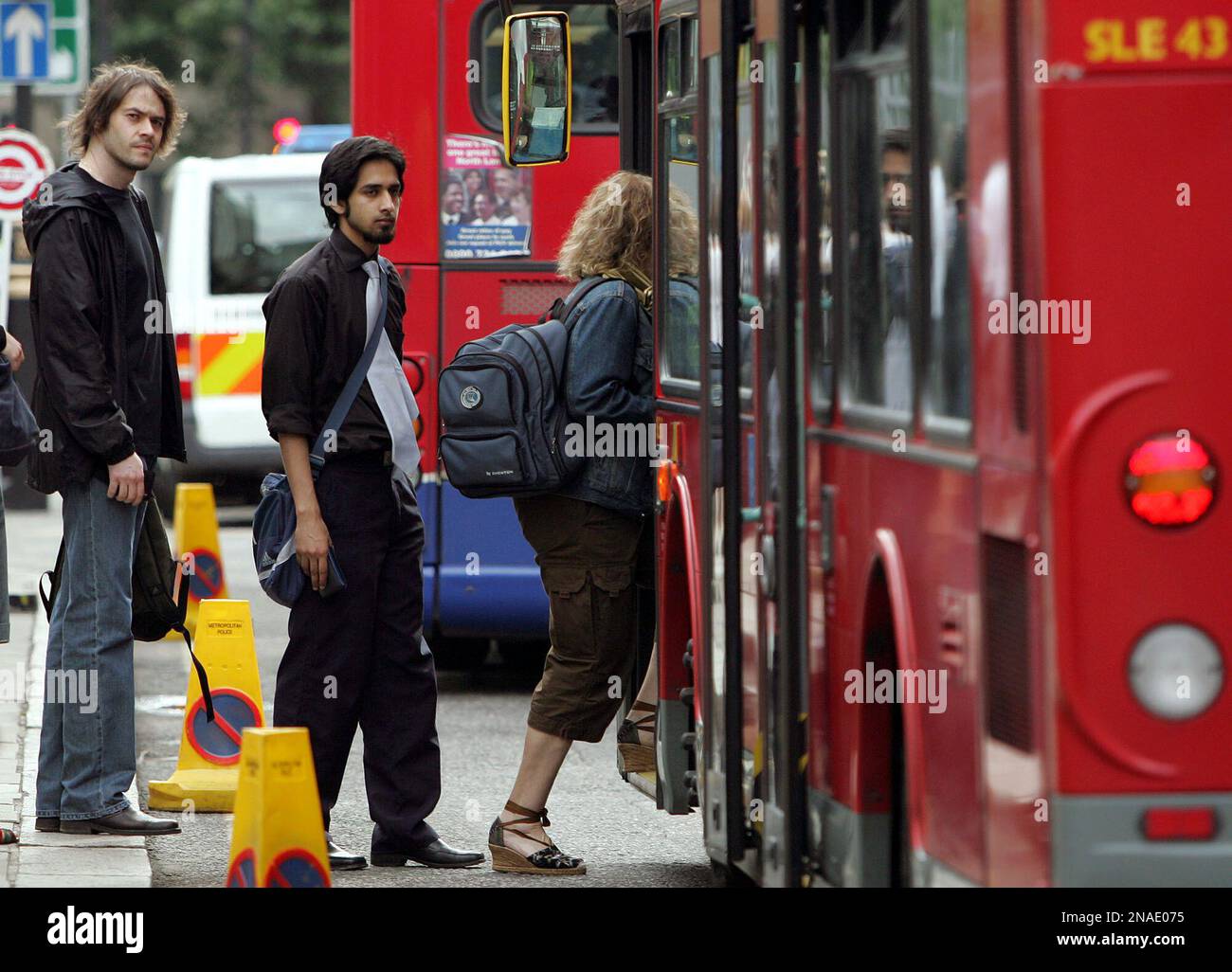 Commuters board a London bus, in central London, Friday July 7, 2006. Friday is the first ...