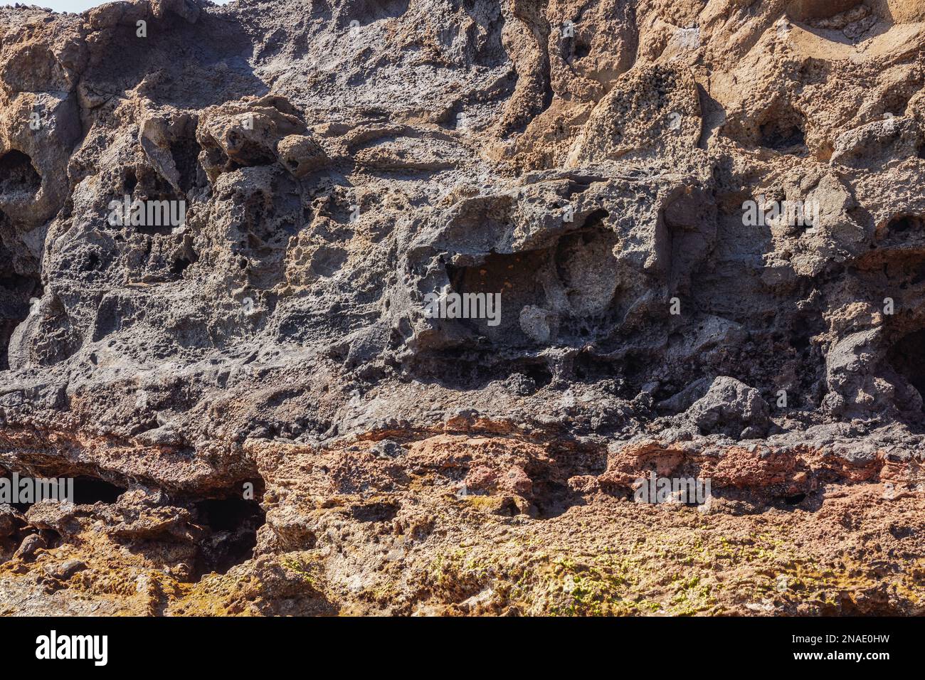 Landscape of sand and volcanic mountains with caves in the canary ...
