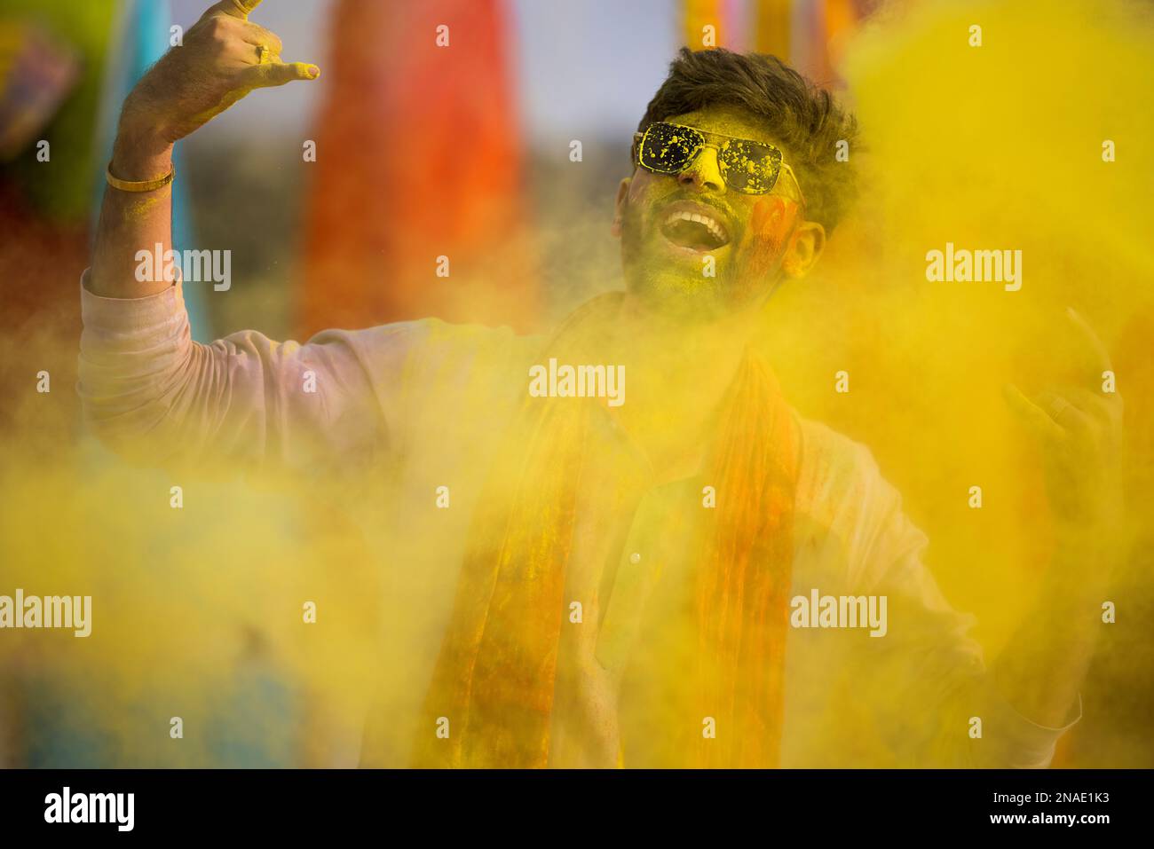 man celebrating holi with dry color Stock Photo - Alamy