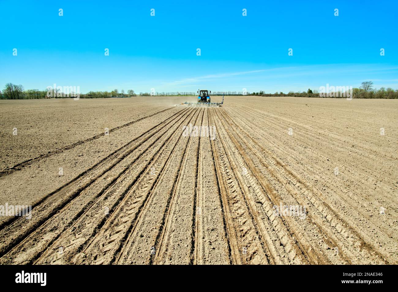 tractor land cultivation agriculture farmer Stock Photo - Alamy