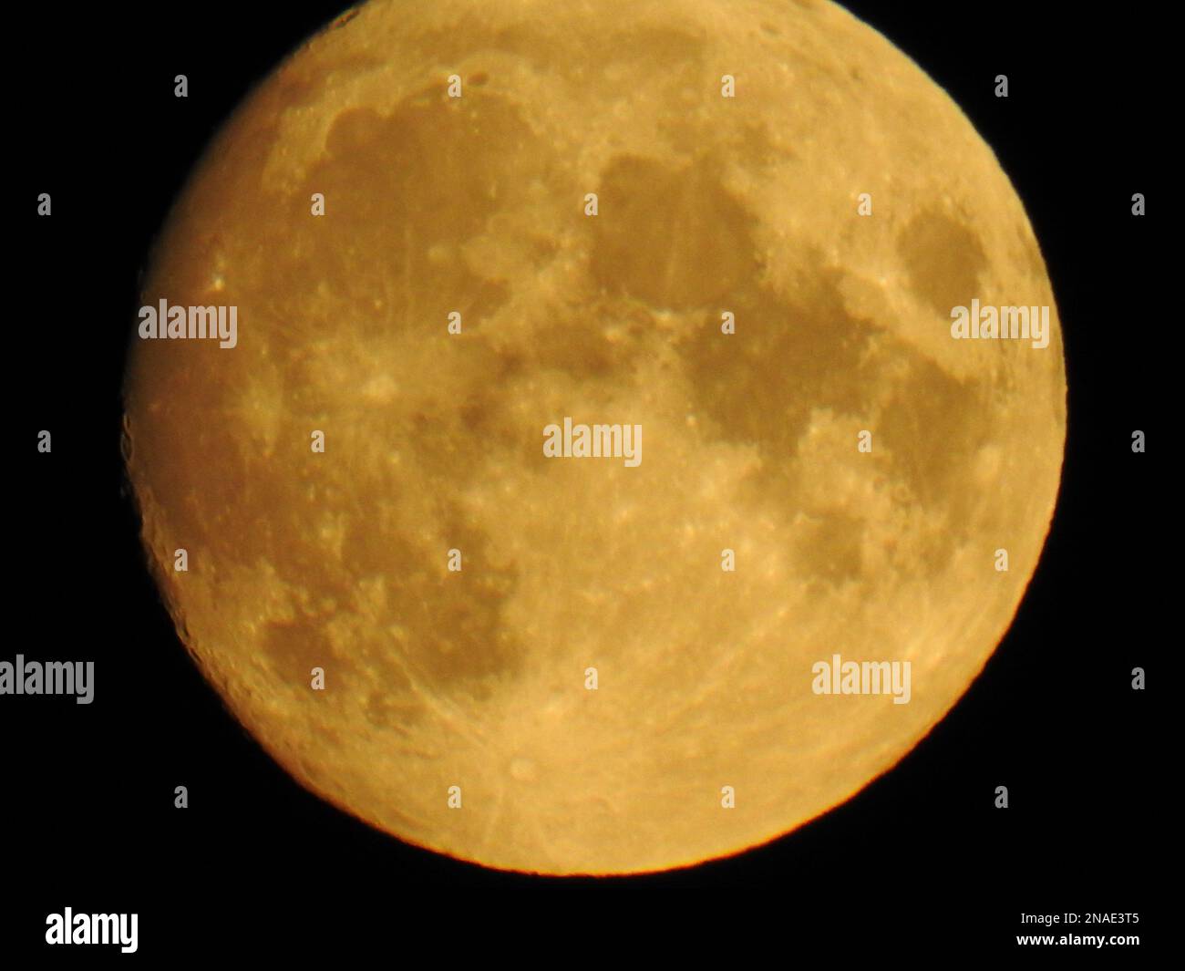 A full moon illuminated in the night sky, shining brightly against a ...