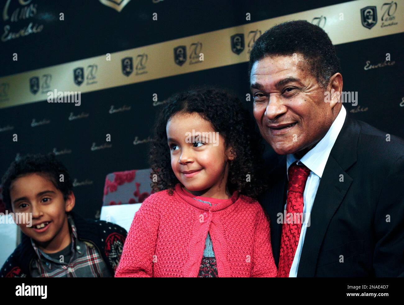 Former Portuguese soccer player Eusebio poses for the media with his ...