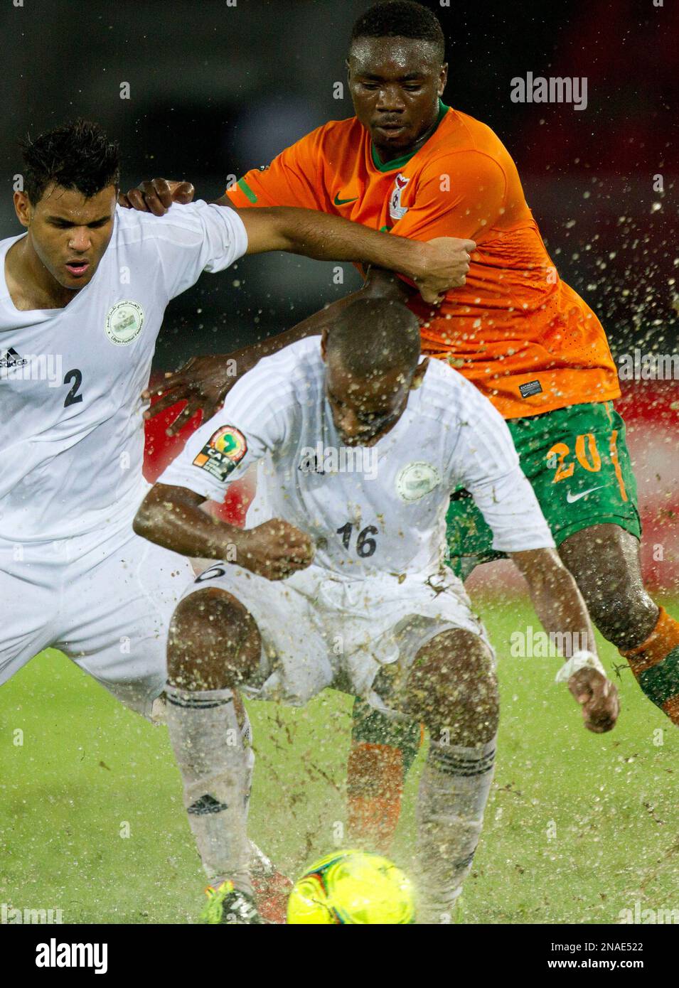 Libya's Rabie Lafi, left, Libya's Abubakr al-Abaidy, center, and Zambia ...