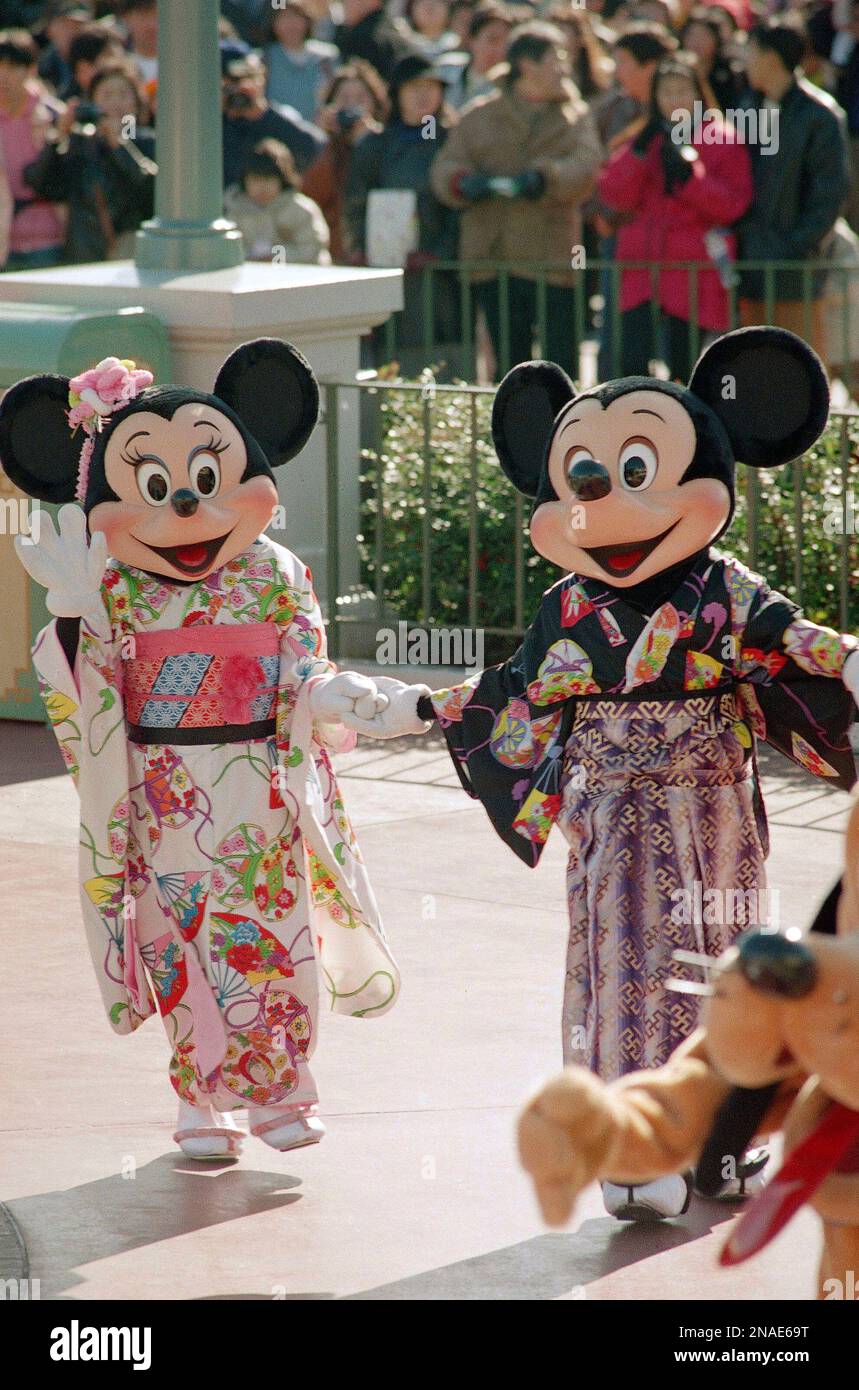 Holding hands, Mickey and Minnie Mouse, in Japanese traditional kimono ...