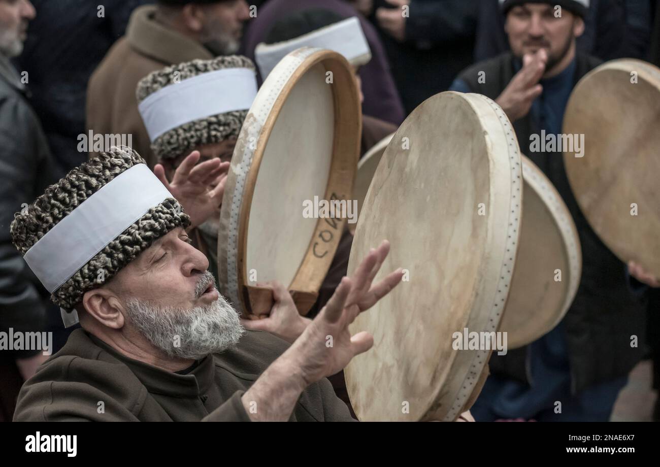 White Hat sufi playing his daf Stock Photo - Alamy