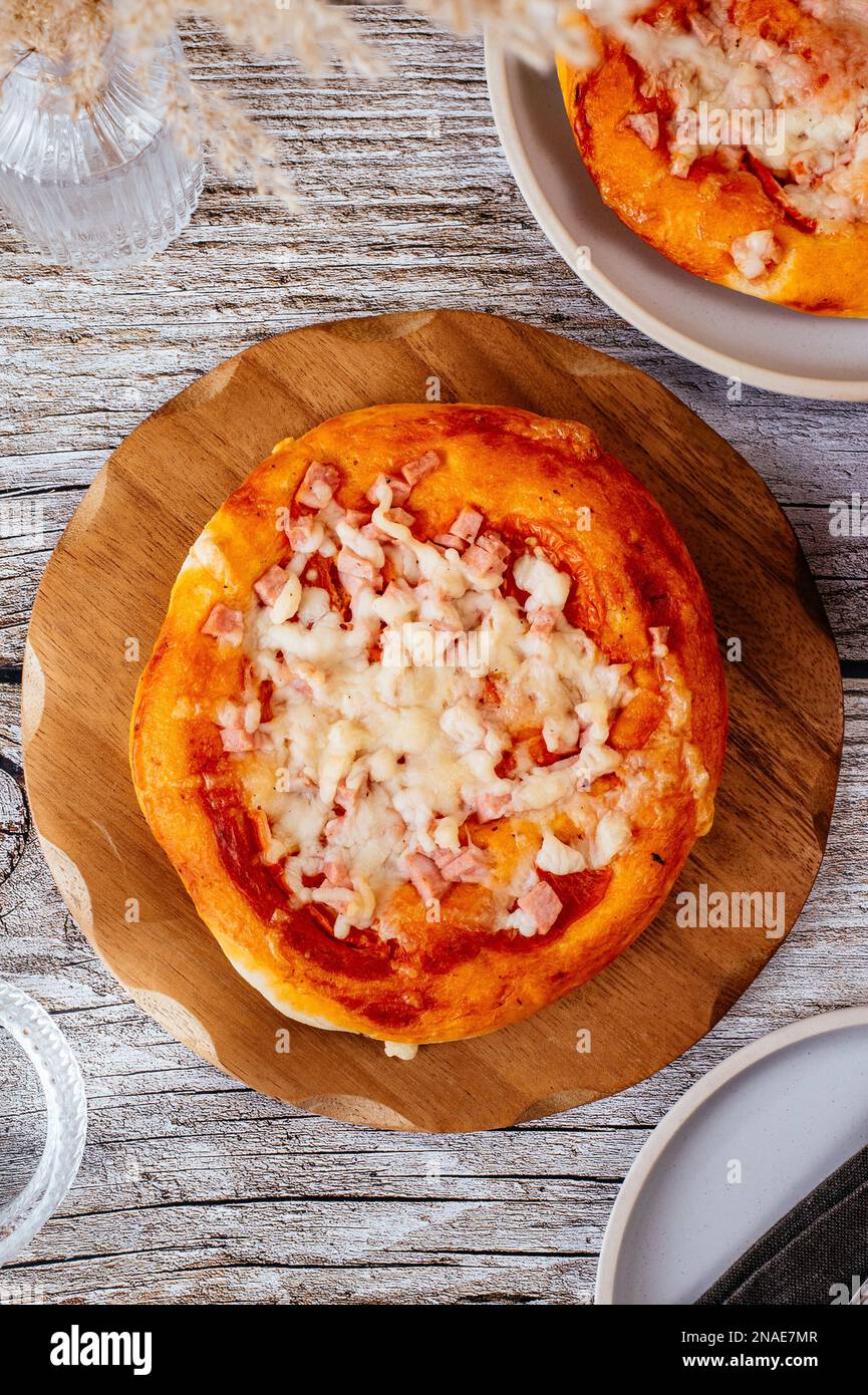 homemade pizza with ham and cheese Stock Photo - Alamy