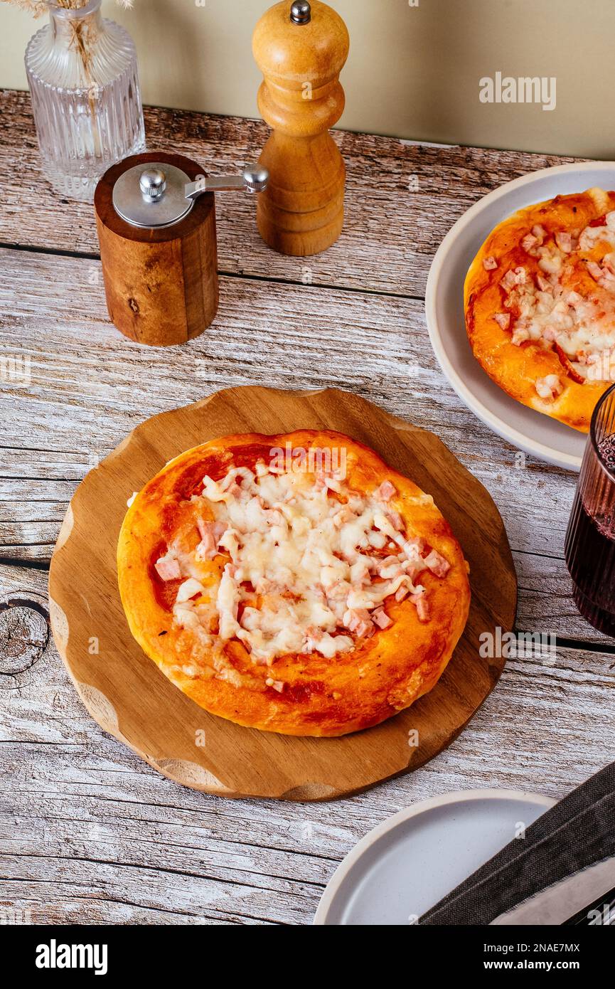 homemade pizza with ham and cheese Stock Photo - Alamy
