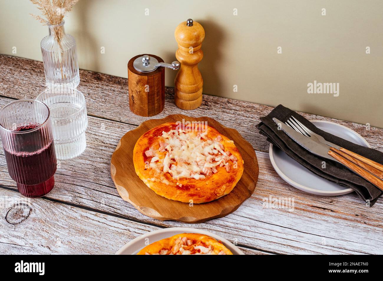 homemade pizza with ham and cheese Stock Photo - Alamy