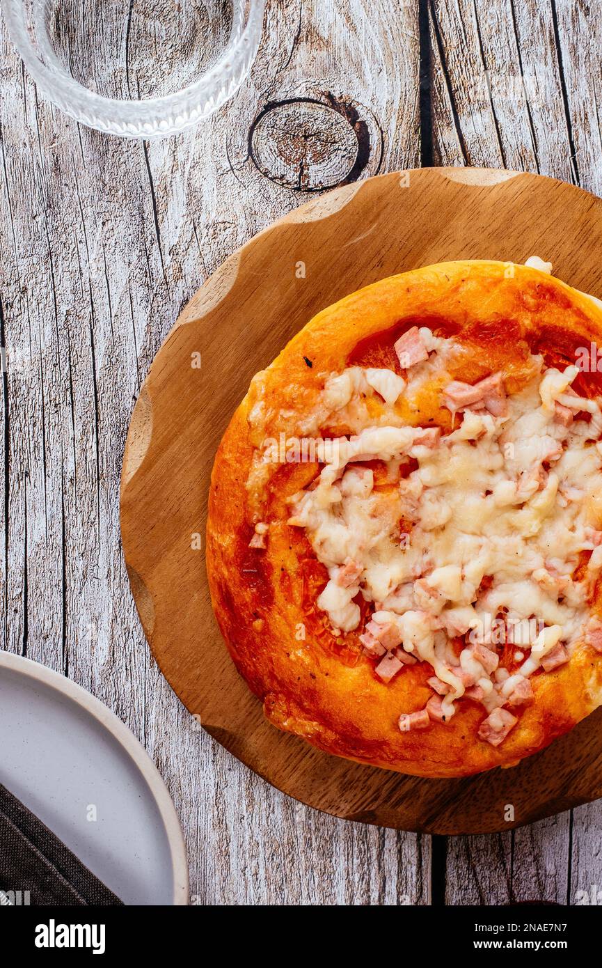 homemade pizza with ham and cheese Stock Photo - Alamy