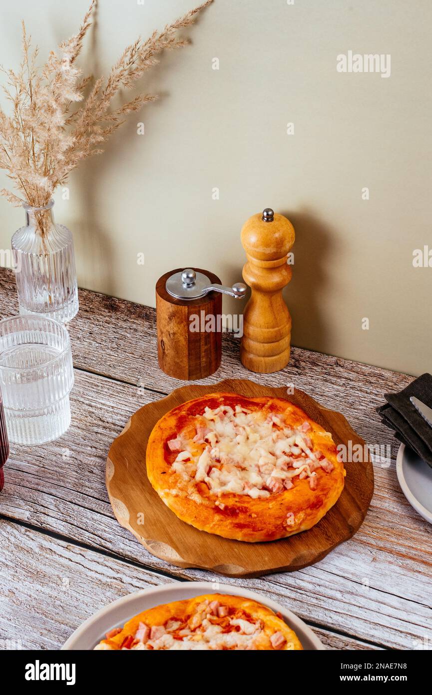 homemade pizza with ham and cheese Stock Photo - Alamy