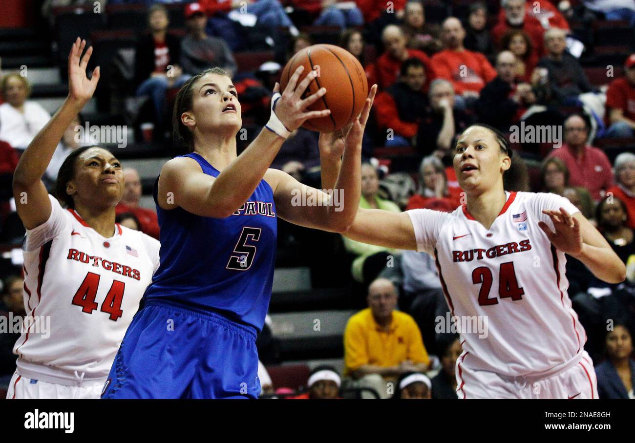 DePaul's Anna Martin (5) shoots past Rutgers' Betnijah Laney (44) and ...