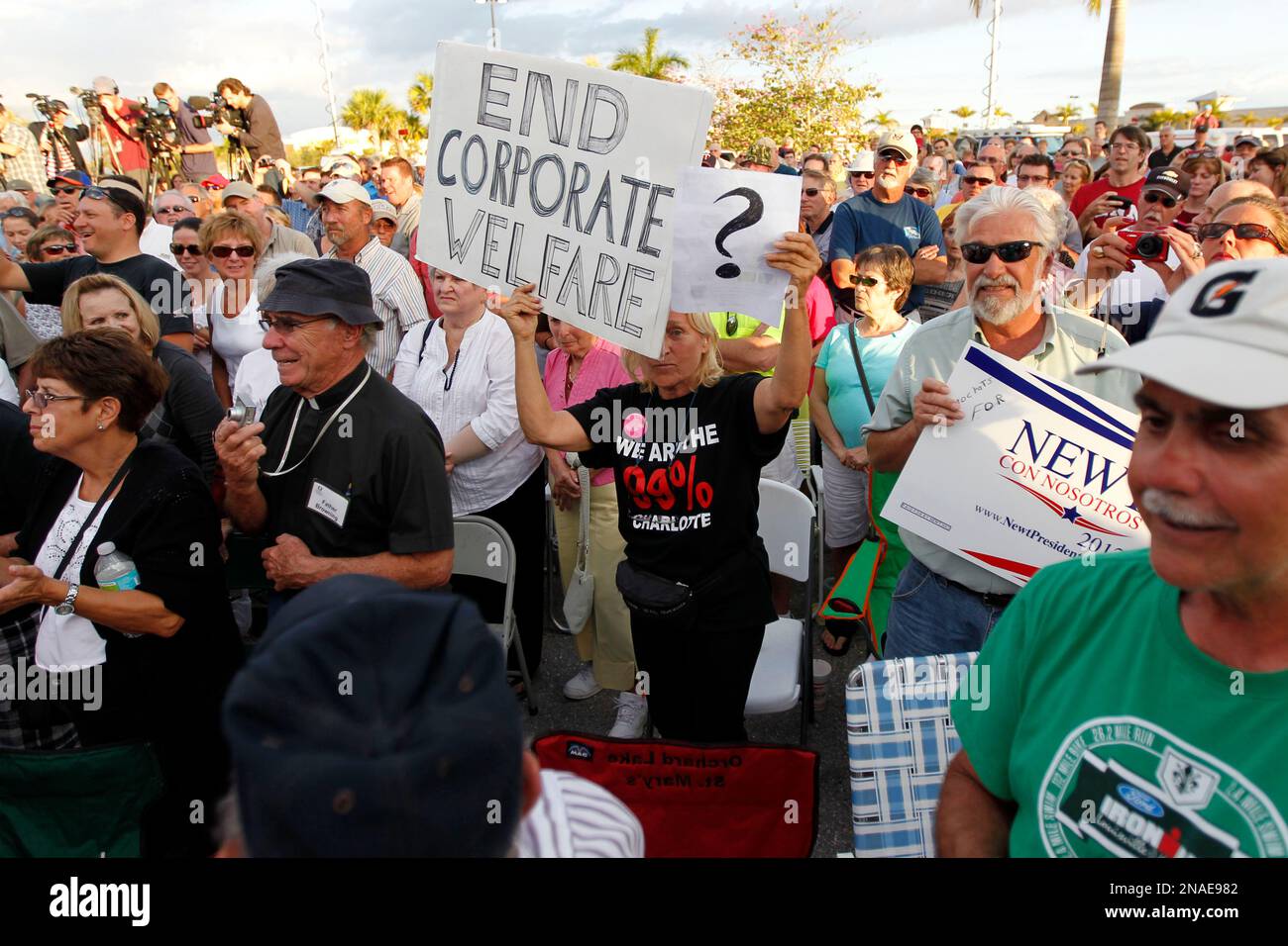 A member of the Occupy movement displays a sign during Republican ...