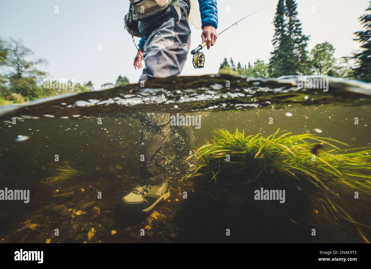 Underwater photo of man walking on river bottom Stock Photo - Alamy