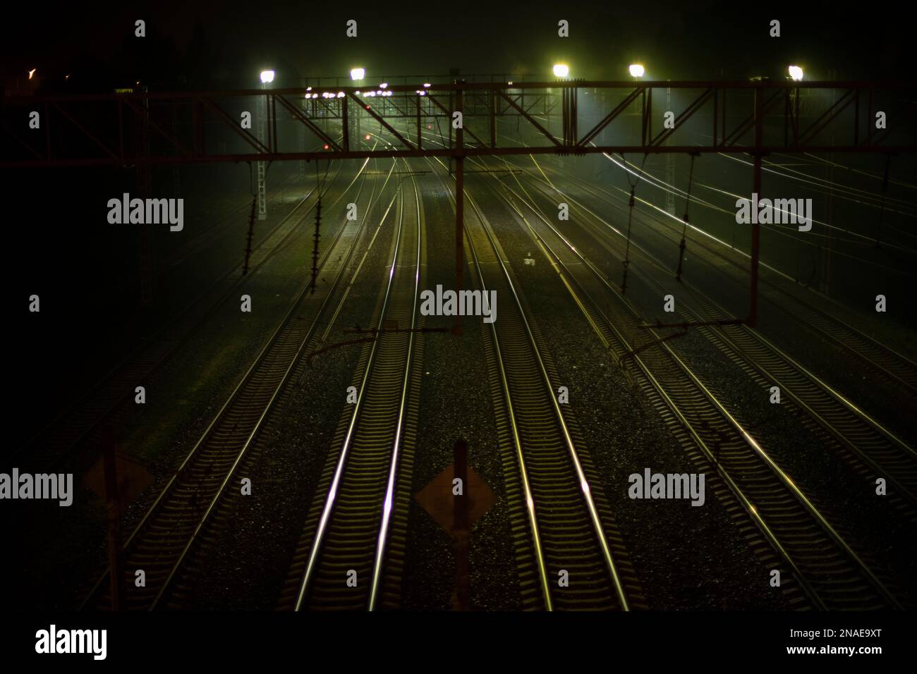 Railroad at night. Rails at station. Many tracks for trains Stock Photo - Alamy