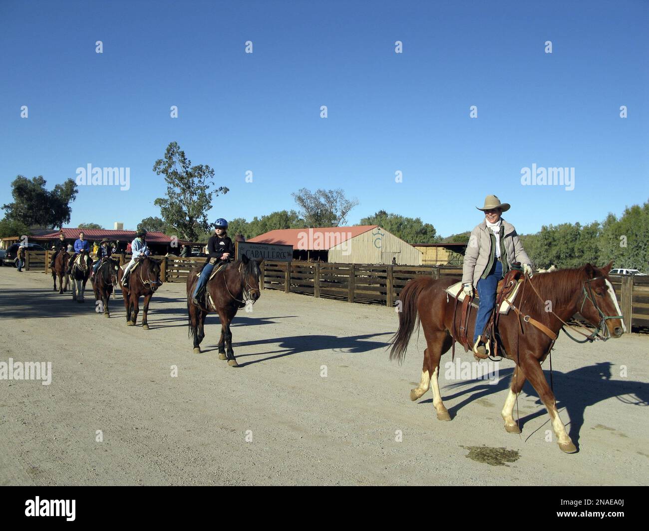 In this Dec. 24, 2011 photo, guests ride horses at Rancho de los ...
