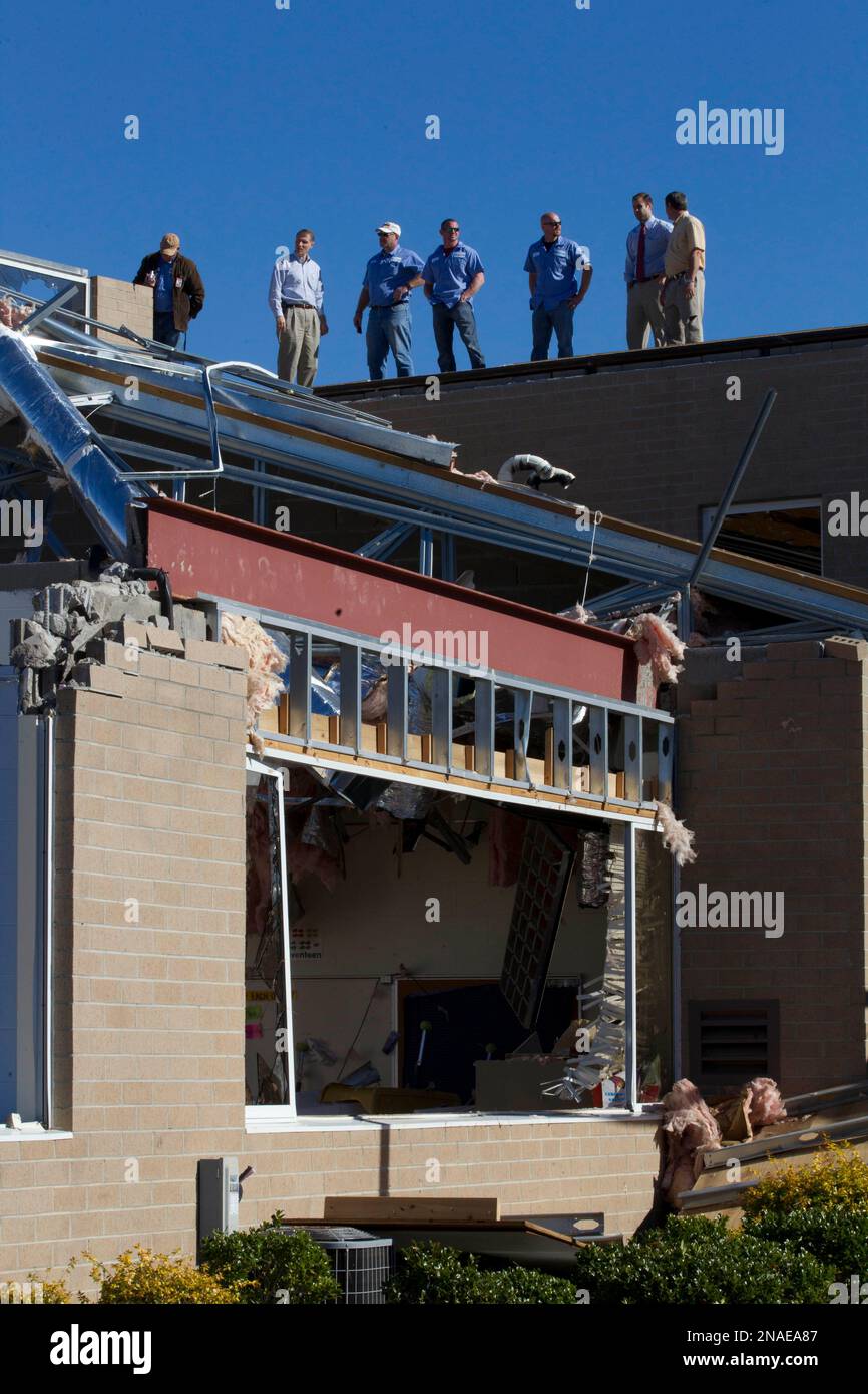 Workers survey the damage to the Center Point Elementary School in ...