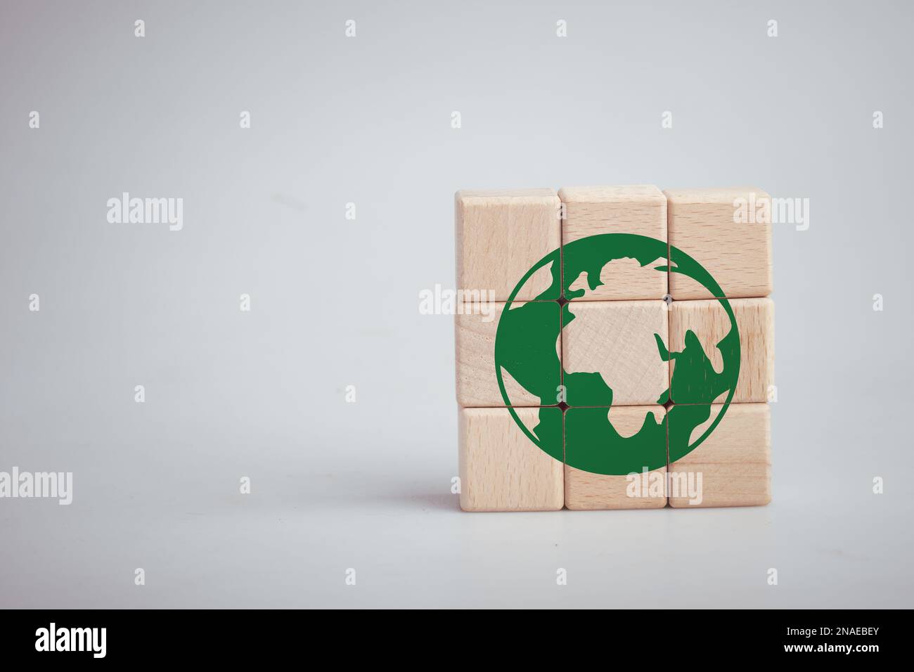 Wooden block with green earth icon. Green earth love concept Stock ... Wooden block with green earth icon. Green earth love concept Stock ...