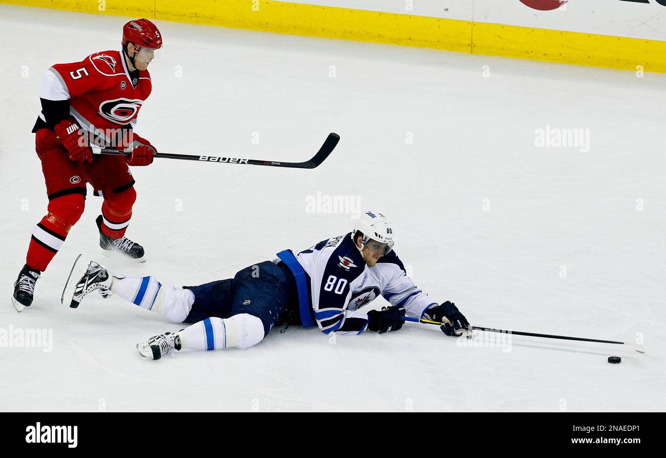 Carolina Hurricanes' Bryan Allen (5) chases Winnipeg Jets' Nik Antropov ...