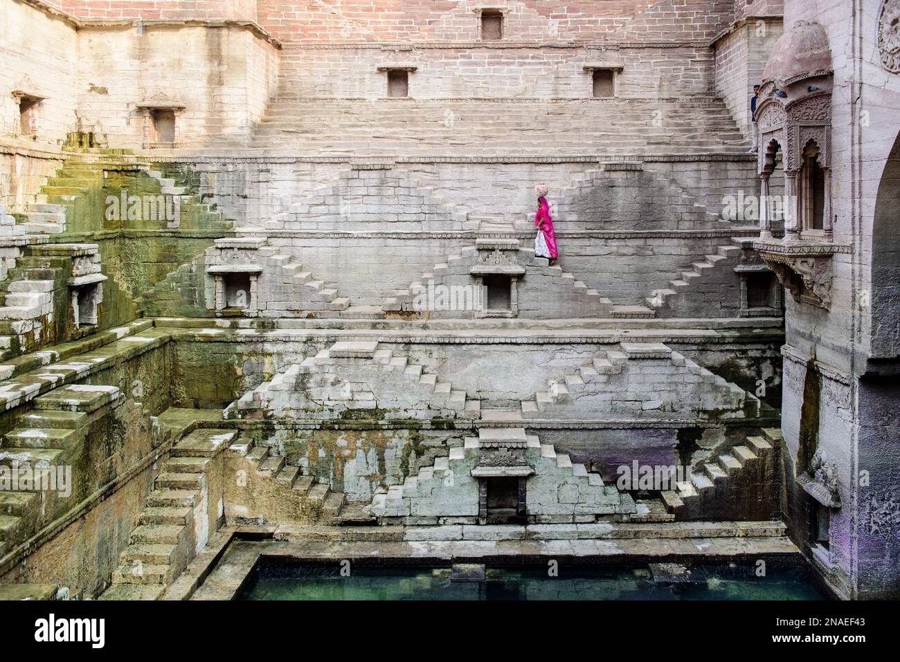 Woman collecting water hi-res stock photography and images - Alamy