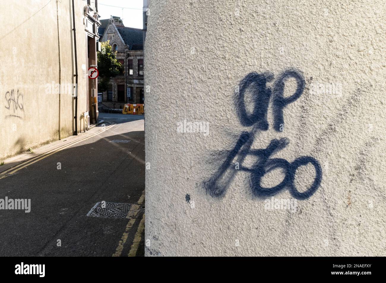 Ugly graffiti tag sprayed over a wall in Newquay Town centre in ...