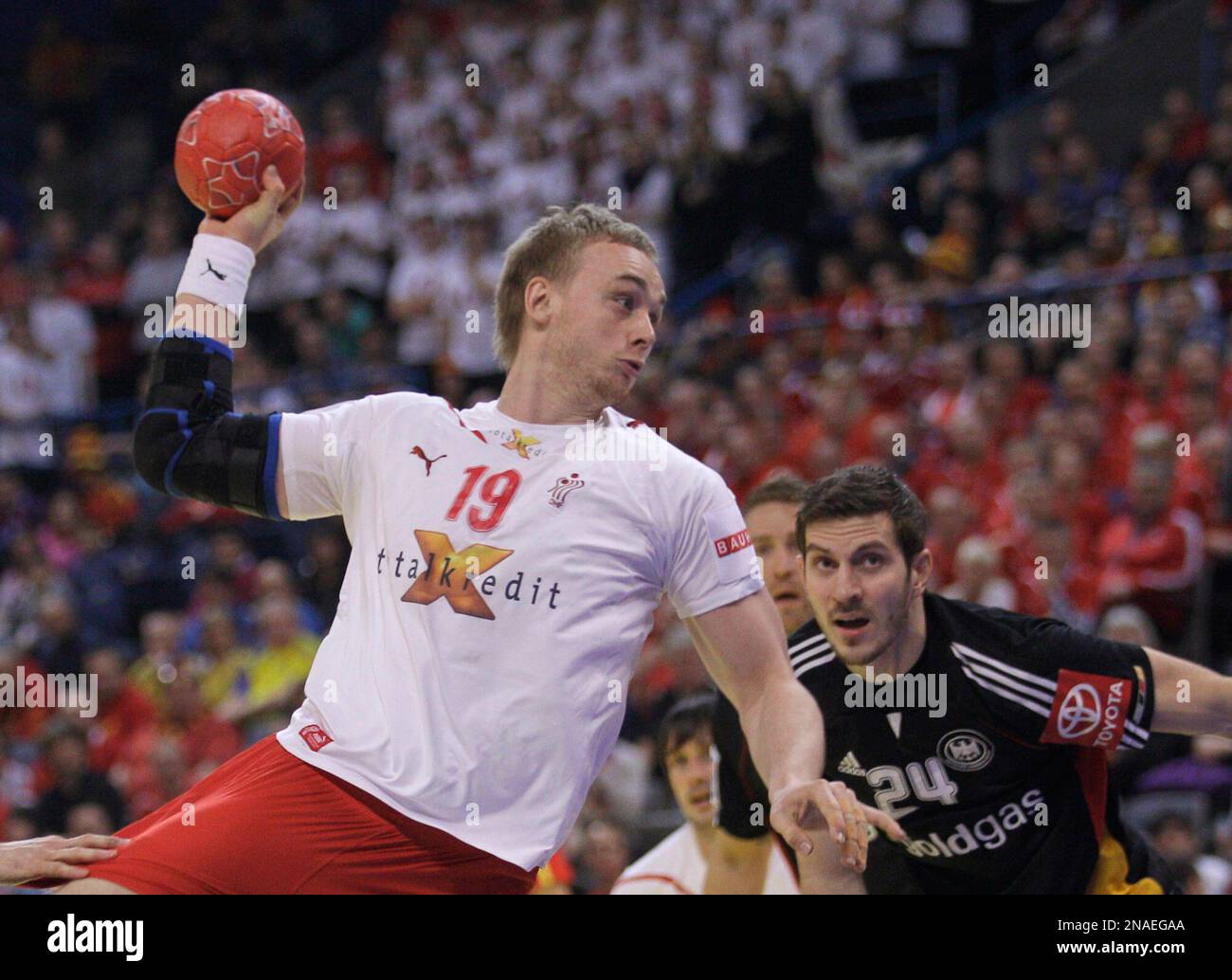Denmark's Rene Toft Hansen, left, competes for the ball with Germany's ...