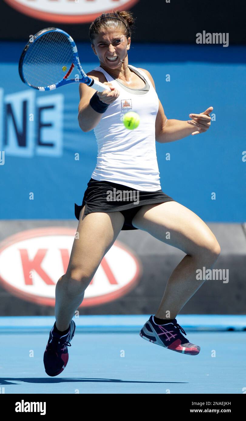 Sara Errani of Italy makes a forehand return to Zheng Jie of China ...