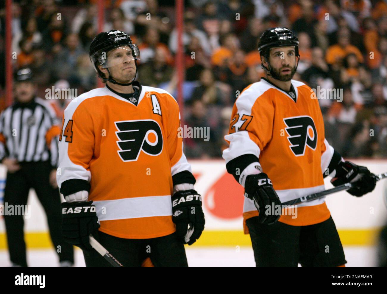 Philadelphia Flyers' Kimmo Timonen, left, and Max Talbot wait for the ...