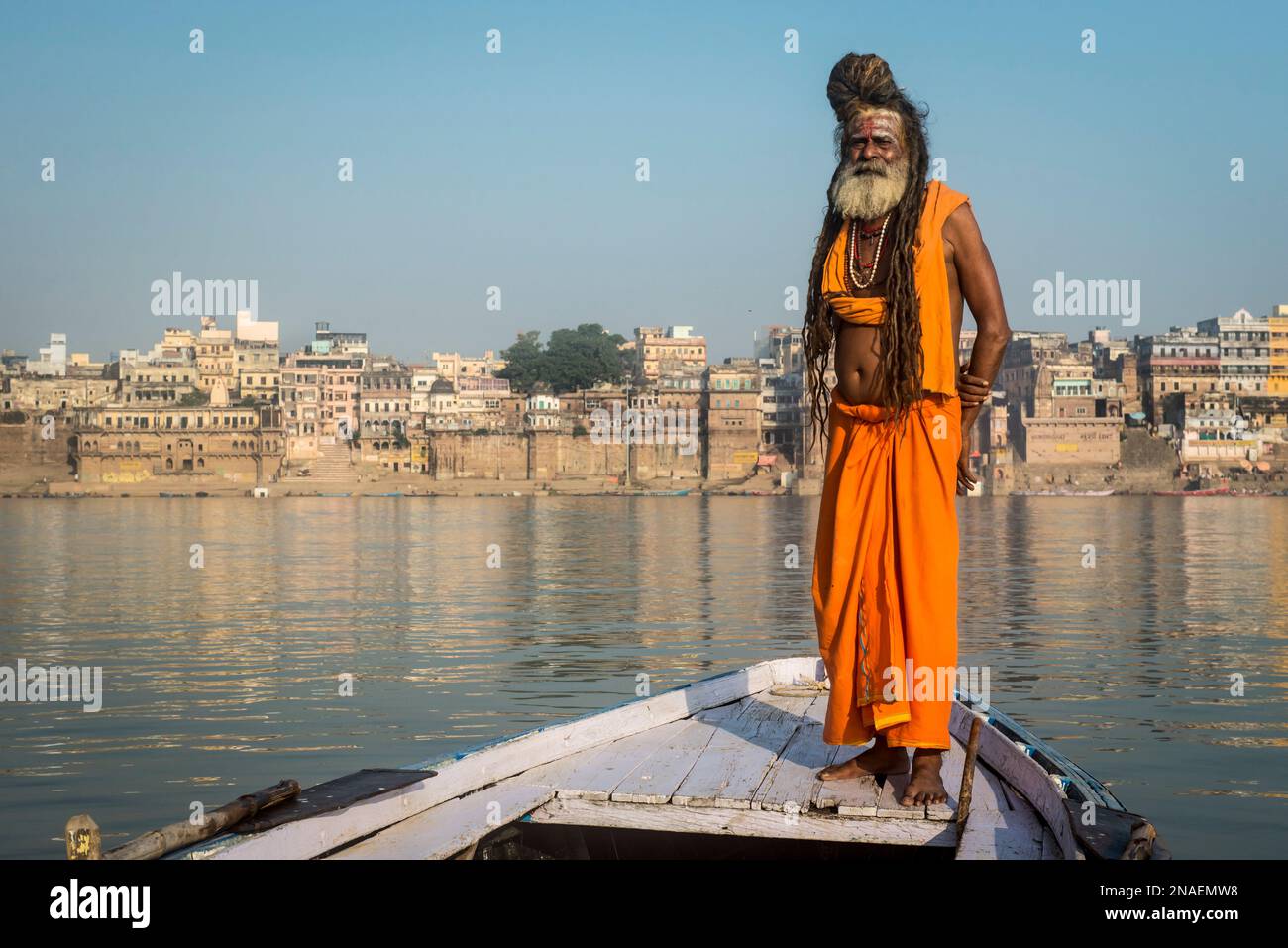 Sadhu standing on boat on the Ganges, Varanasi Stock Photo - Alamy
