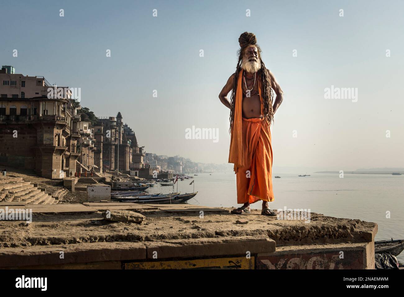 Sadhu standing on ghats along the Ganges; Varanasi, India Stock Photo ...