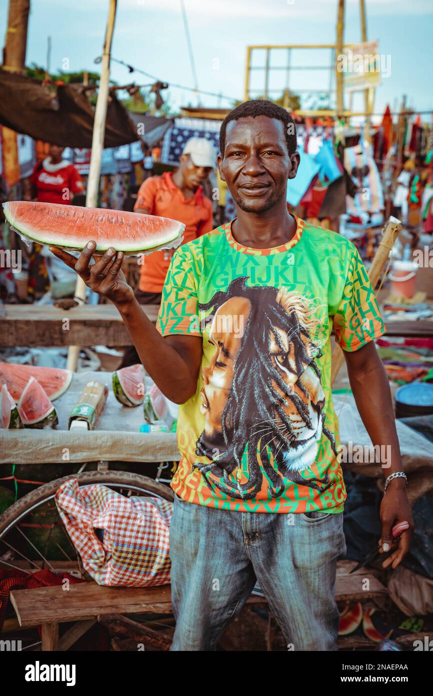 Mwanza, Tanzania - 05.01.2022 - African man selling watermelon at busy ...