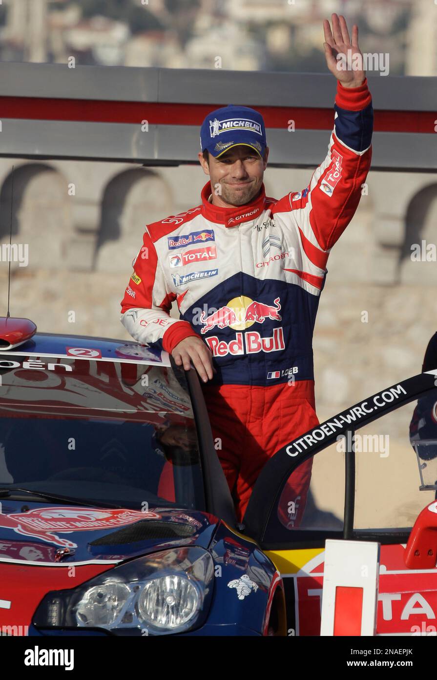 World champion Sebastien Loeb of France waves after winning the 80th ...