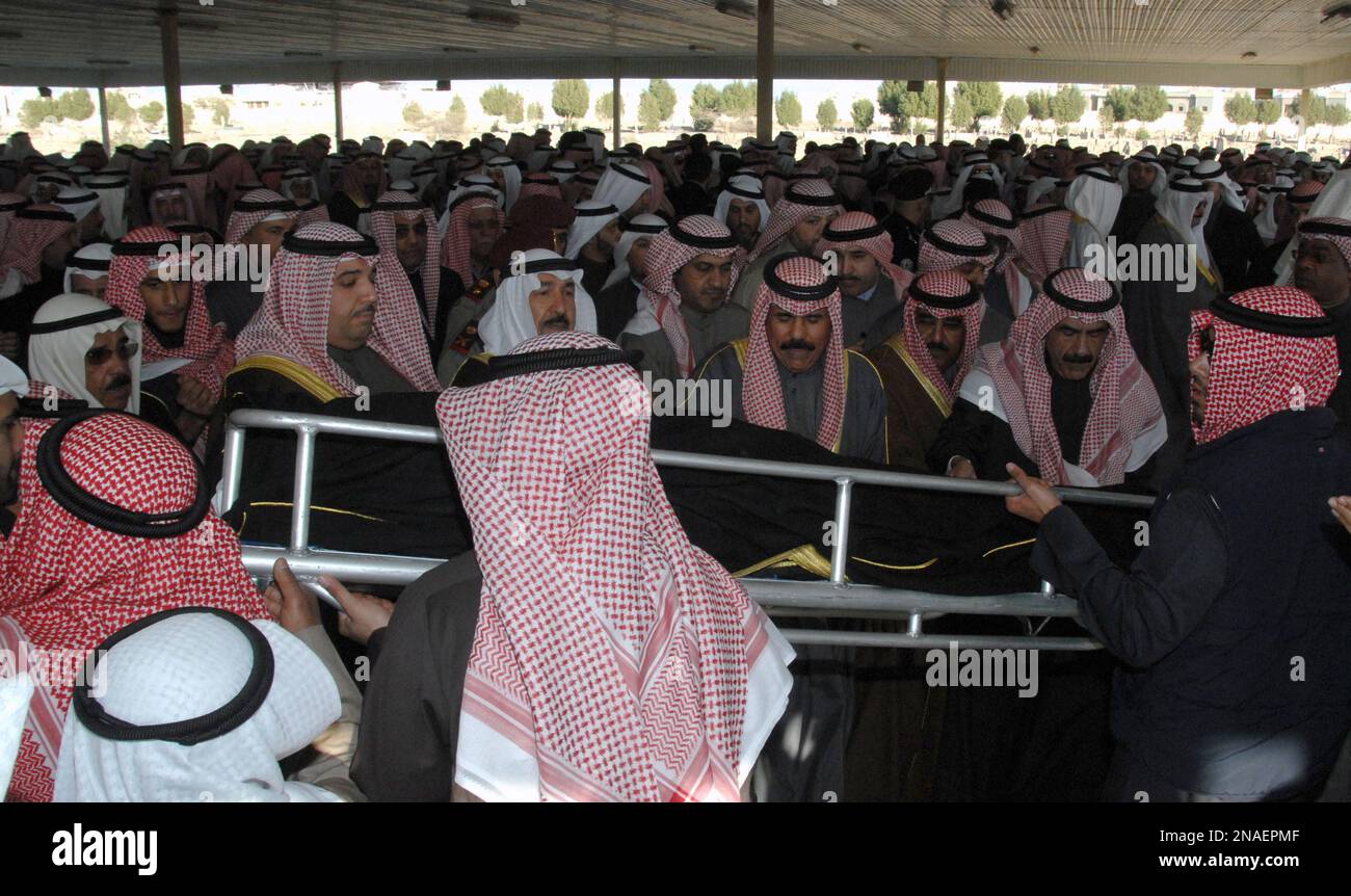 Kuwait's government officials and family members attend the funeral of ...