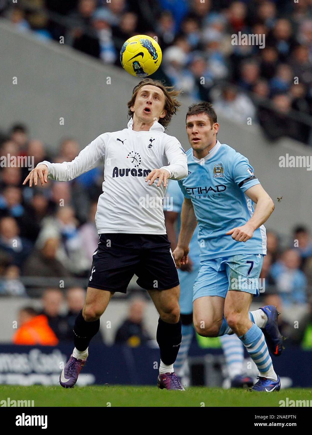 Manchester City's James Milner, right, watches as Tottenham Hotspur's ...