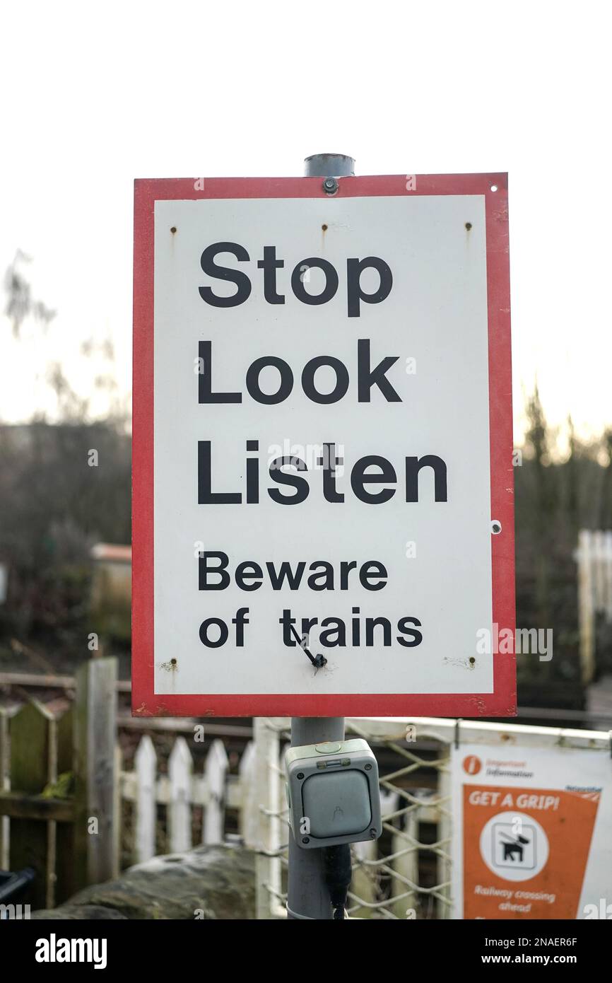 Warning notice. Fast train passing a Stop sign at an unprotected level ...