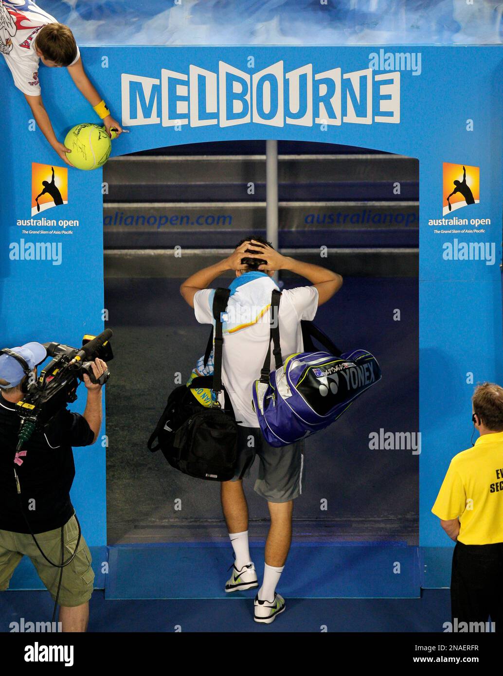 Australia's Bernard Tomic leaves Rod Laver Arena after his loss to ...