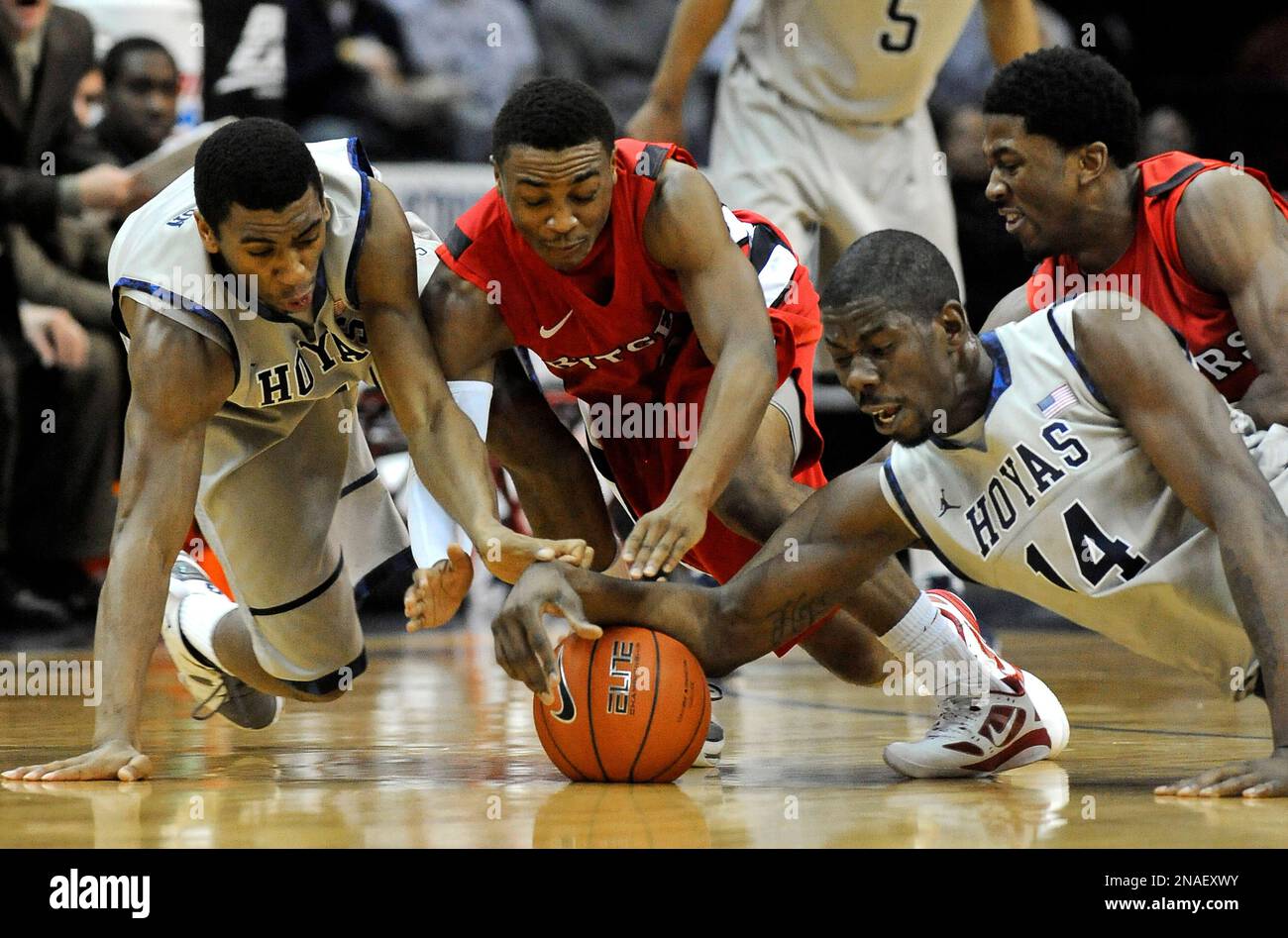 Georgetown's Henry Sims (14) and teammate Hollis Thompson, left, dive ...