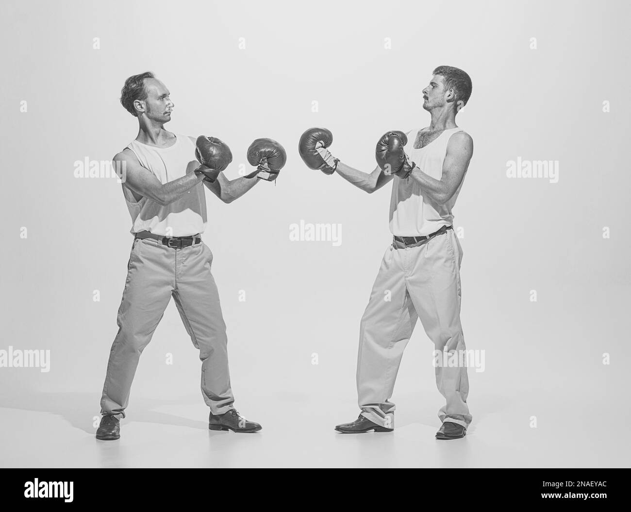 Vintage portrait of two retro men boxing in gloves. Funny image of two ...