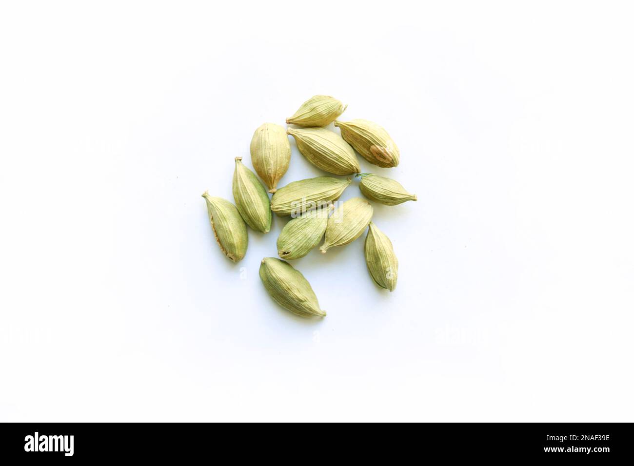Fresh Cardamom stock image on white background Stock Photo - Alamy