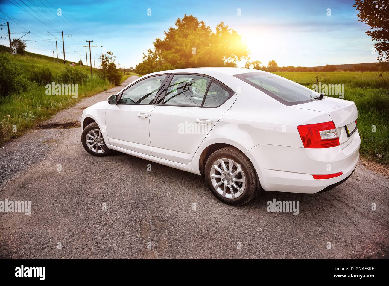 Rear-side view of a car on nature background Stock Photo - Alamy