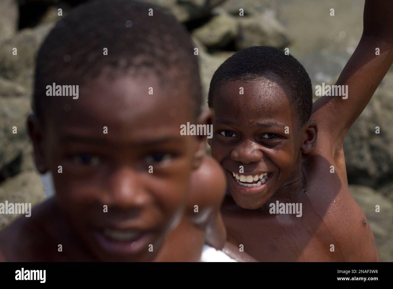 Children smile after swimming in the Atlantic ocean in Bata ,Equatorial ...