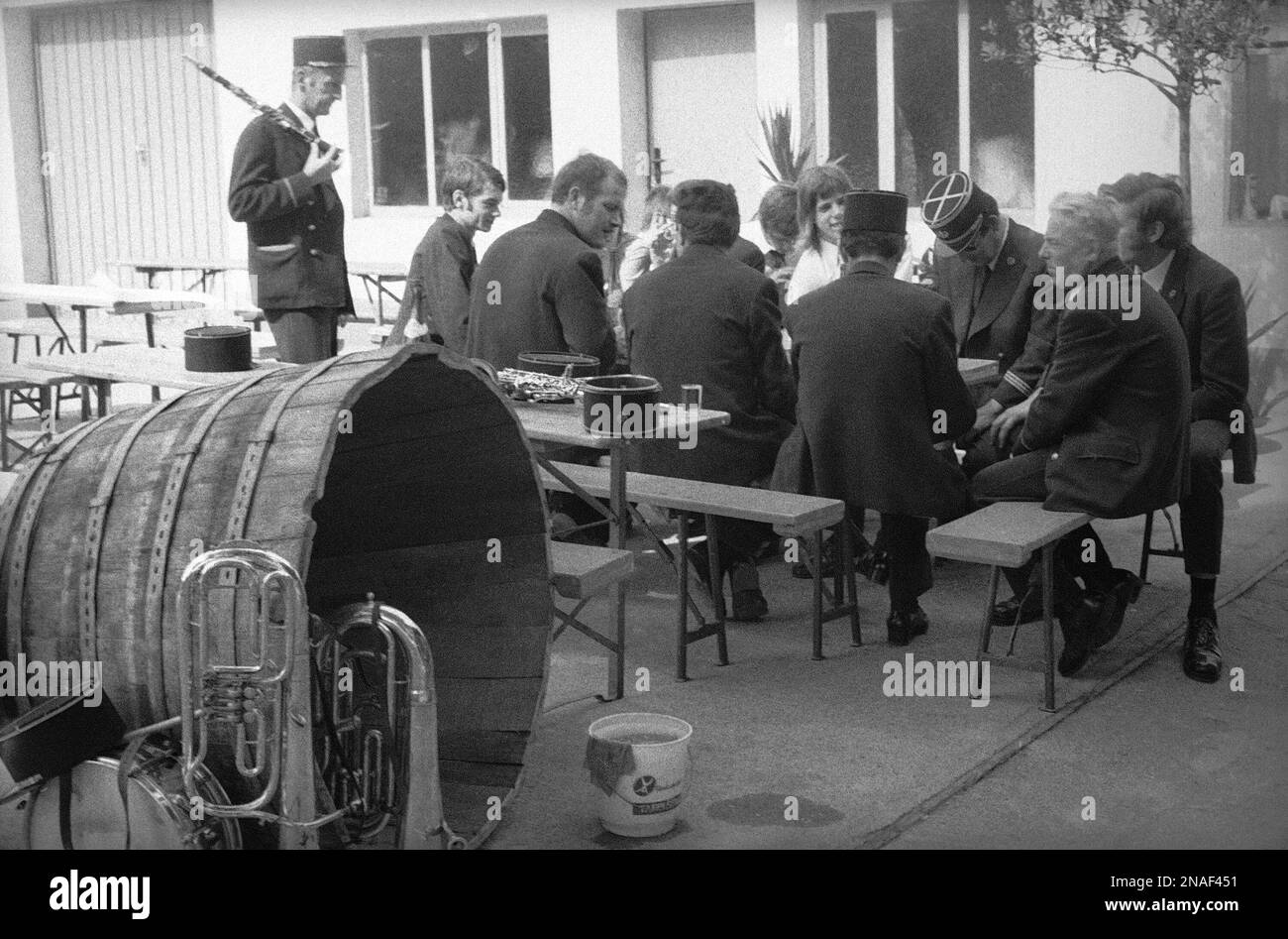Guests sit round the table in one of the open air restaurants in Trier ...