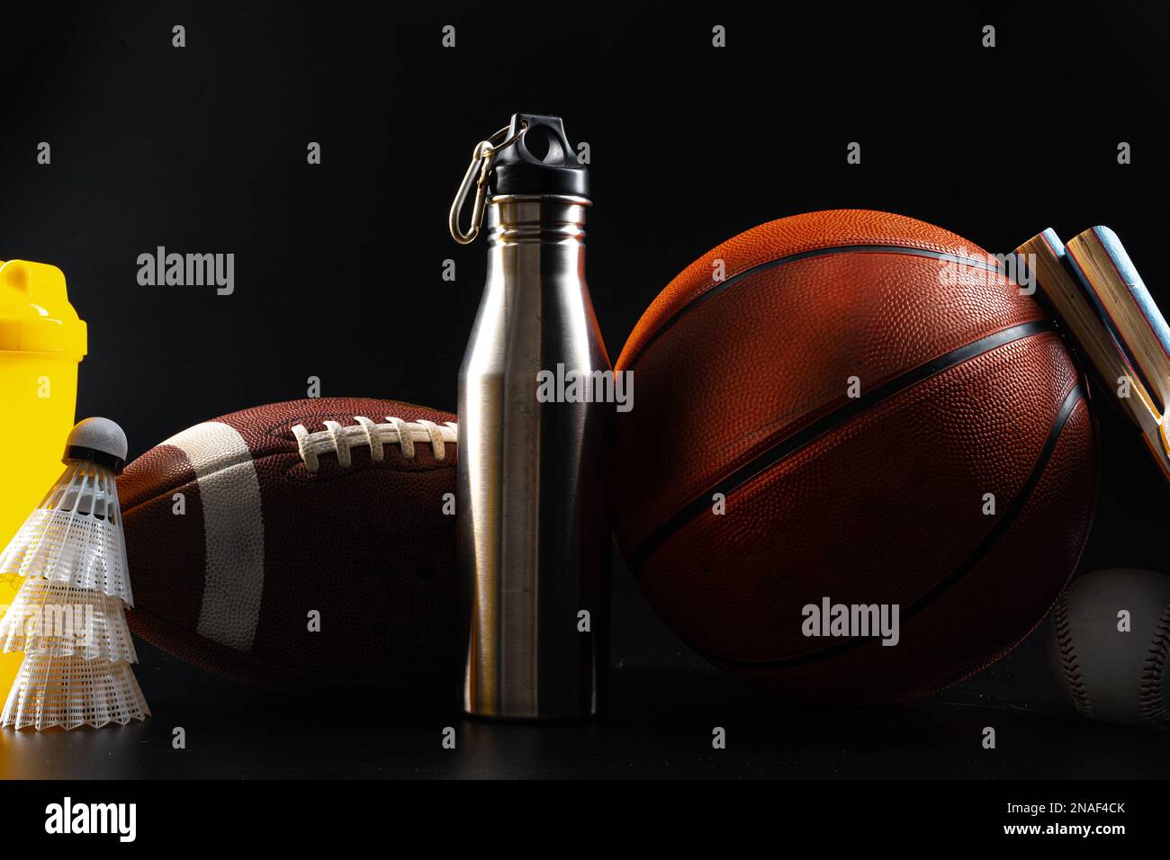 Set of sports equipment and tools on black background Stock Photo - Alamy