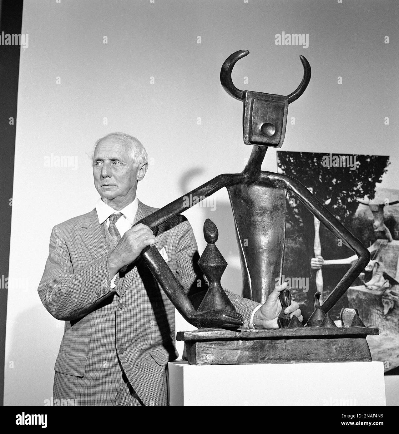 Max Ernst stands by his sculpture at The Museum of Modern Art in New ...