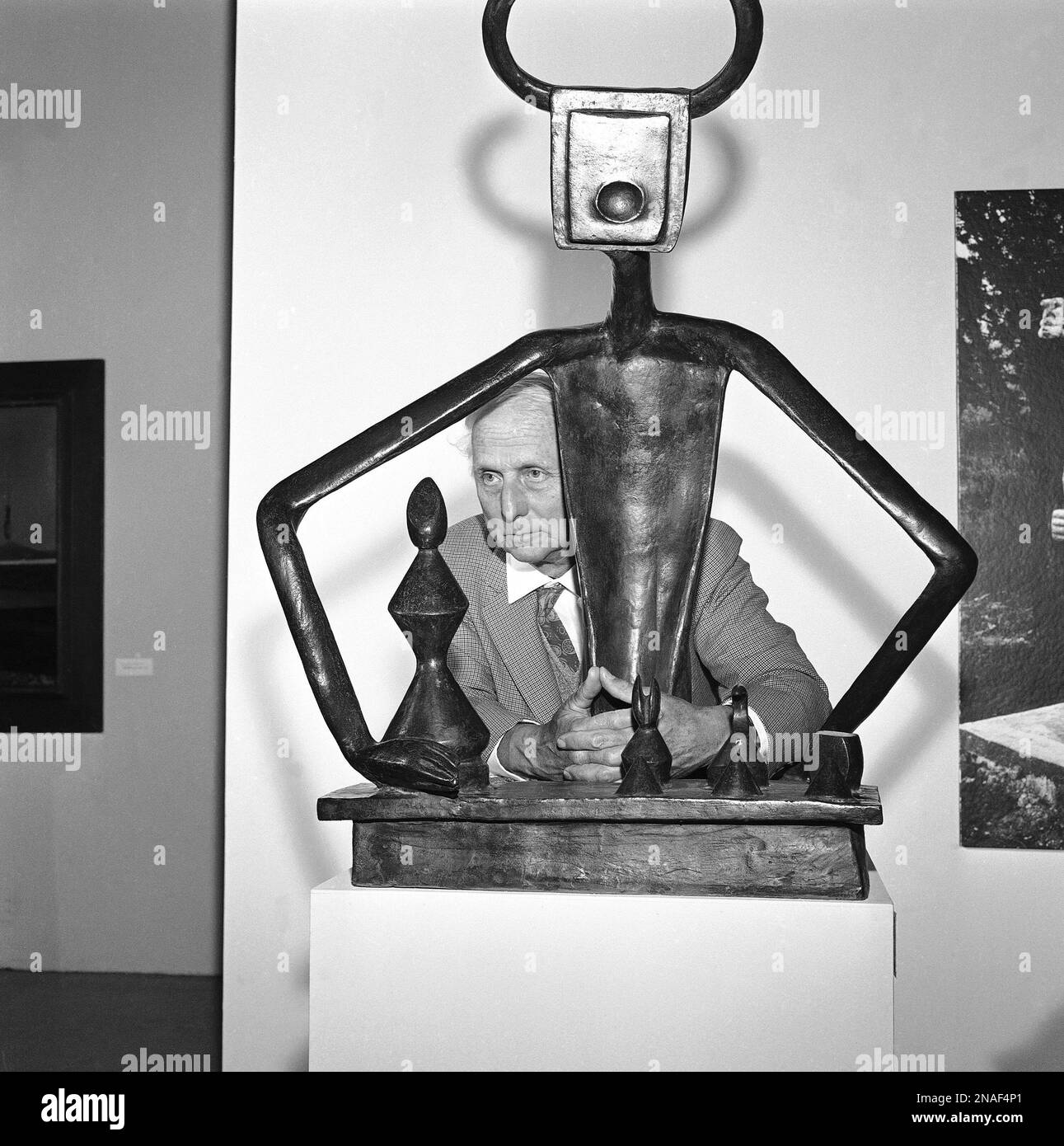 Max Ernst stands by his sculpture at The Museum of Modern Art in New ...