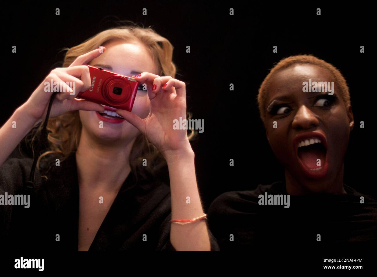 Models jokes as they wait for the rehearsal of the fashion show by ...